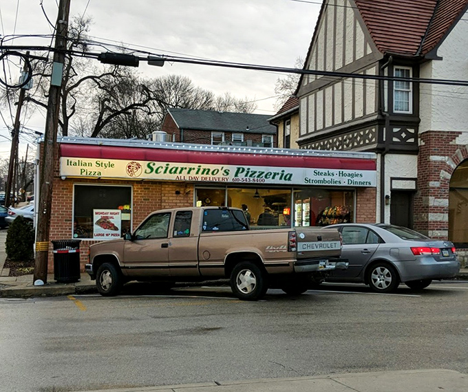 From this humble storefront, pizza dreams come true. The sign promises "Italian Style Pizza"&mdash;and Sciarrino's delivers on that promise with every pie.