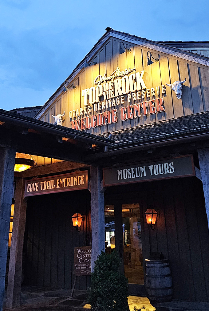 Evening lighting transforms the Top of the Rock entrance into a magical gateway to underground adventures.