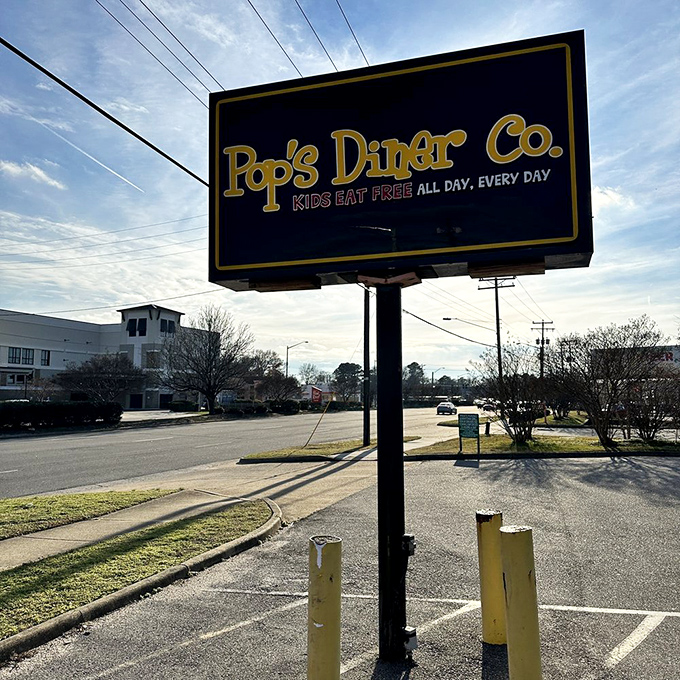 The roadside sign announces "Kids Eat Free" against the sky&mdash;words that sound like music to parents' ears everywhere.