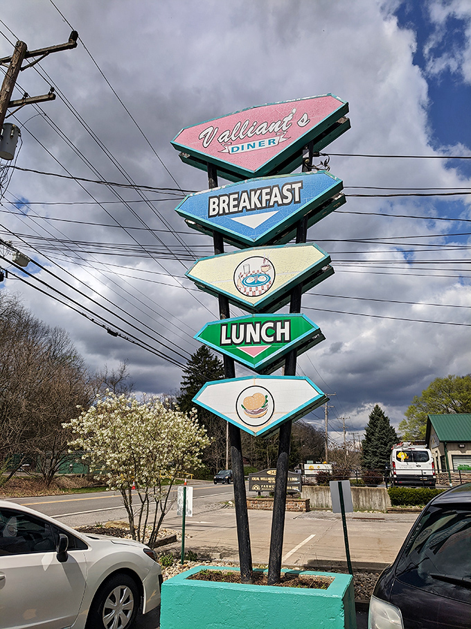 This vintage sign doesn't just advertise a diner&mdash;it's a colorful beacon of hope for the hungry, promising breakfast and lunch salvation ahead.