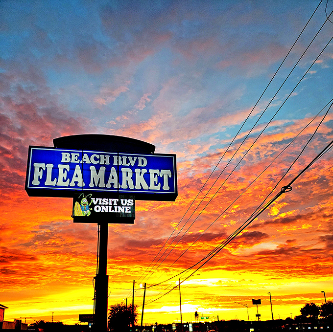The market's sign glows against a spectacular Florida sunset, promising adventures in bargain hunting that begin again with the next sunrise.