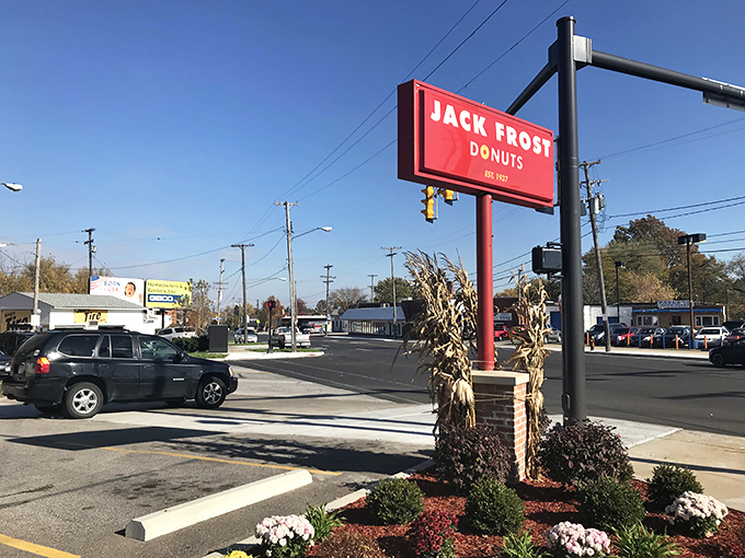 The iconic street sign stands tall against the Cleveland sky, a landmark that's guided hungry pilgrims to donut salvation since 1937.