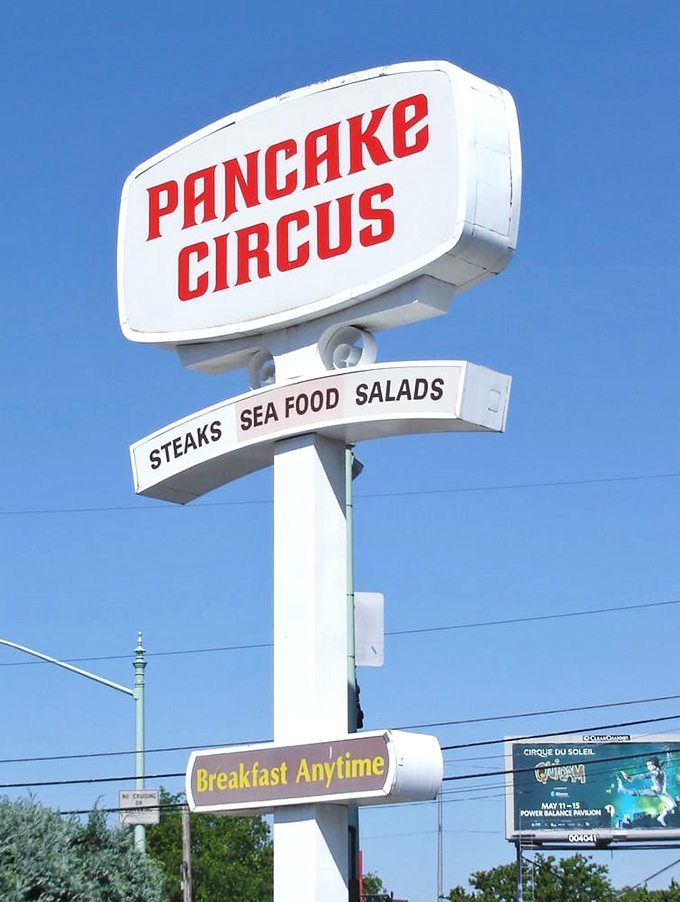 The vintage roadside sign promises "Breakfast Anytime"&mdash;three syllables that might be the most beautiful phrase in the English language.