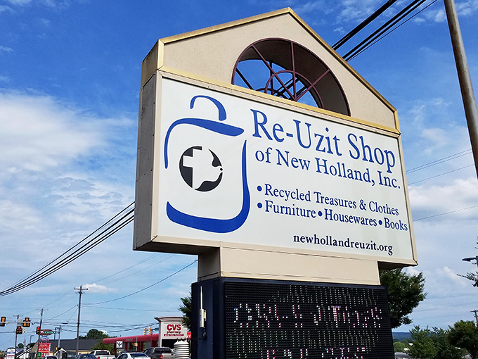 The roadside sign announces the mission clearly: "Recycled Treasures & Clothes." A siren call to those who appreciate the thrill of the hunt.