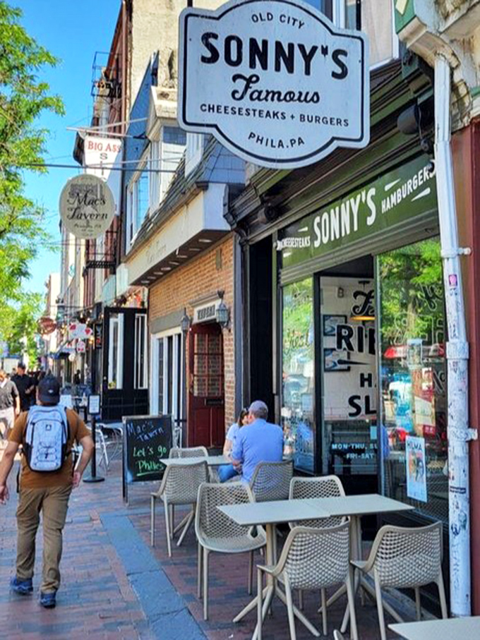 Sonny's Famous Steaks stands proudly on Market Street, where the cobblestones have witnessed centuries of history but few sandwiches this good.