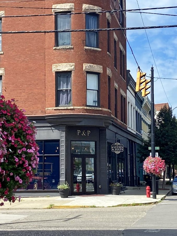 Corner location, hanging flower baskets, and historic charm &ndash; the trifecta of curb appeal. This street view promises the quintessential small-town dining experience with big-city flavor.