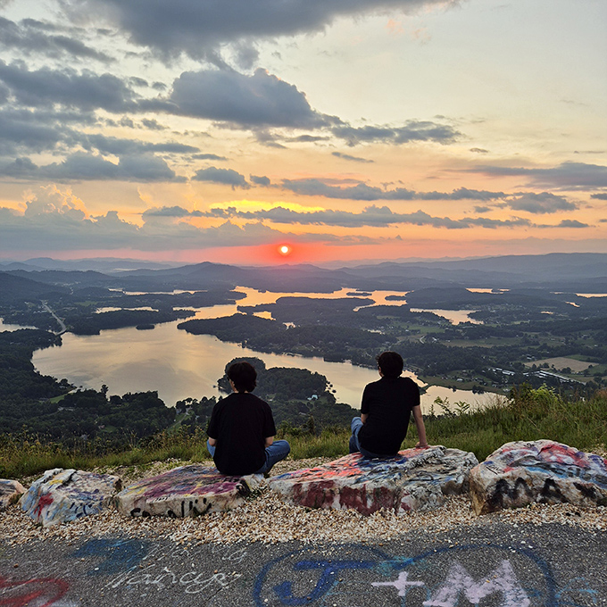 Sunset therapy, mountain style. Two silhouettes remind us that sometimes the best conversations happen when words take a backseat to nature's evening light show.