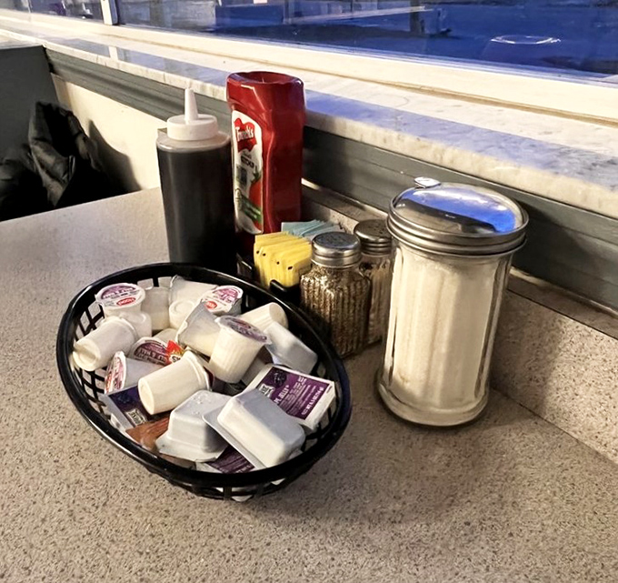 The classic diner table setup&mdash;sugar, creamer, and condiments standing at attention, ready to transform your breakfast from great to transcendent.