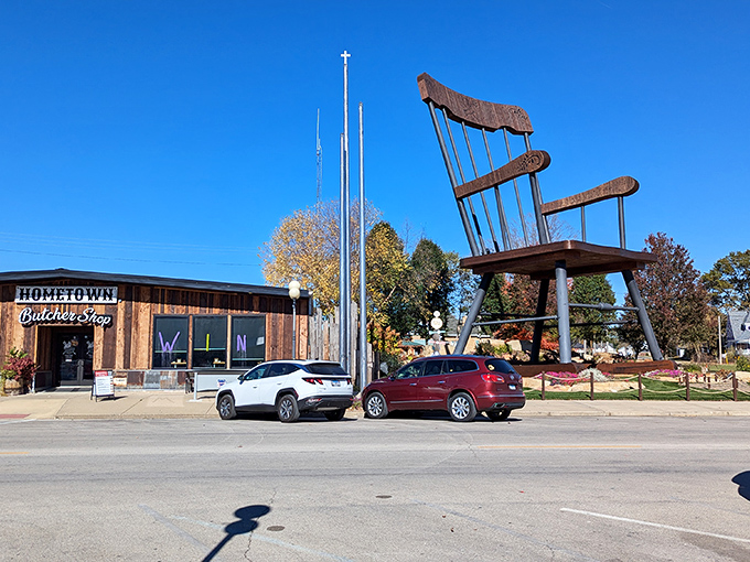 The Hometown Butcher Shop seems almost embarrassingly normal-sized next to its famous wooden neighbor.