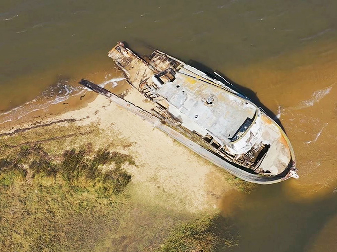 Aerial view reveals the shipwreck's perfect positioning in the landscape. Mother Nature's installation art puts modern galleries to shame.