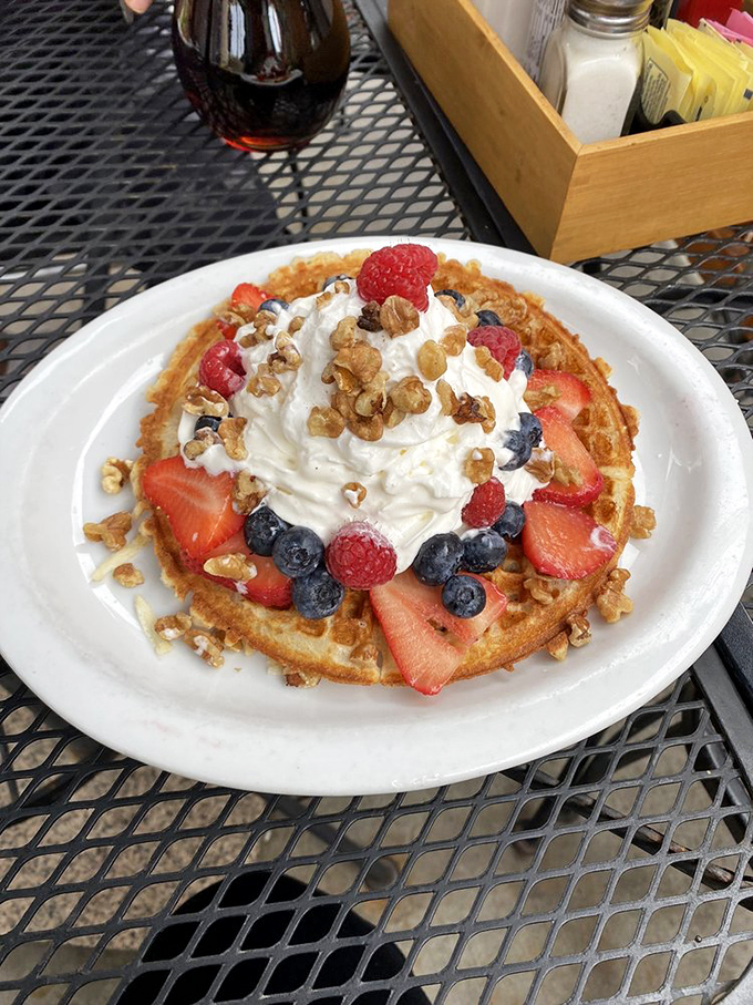 Golden waffles with perfect squares designed by nature to hold syrup - breakfast engineering at its most delicious.