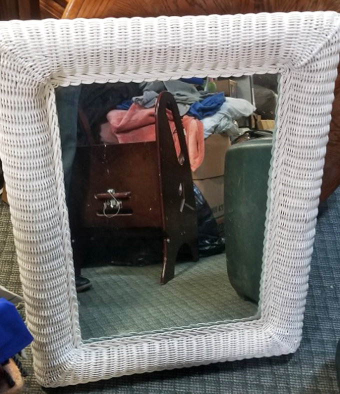 A wicker-framed mirror that's reflected a thousand outfits and "does this look okay?" moments, ready to offer its honest opinions to a new owner.