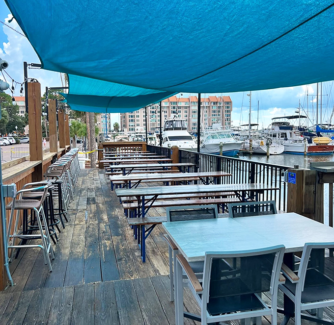 The waterfront deck where memories are made. One table, one view, one perfect Florida afternoon that will haunt your winter dreams.