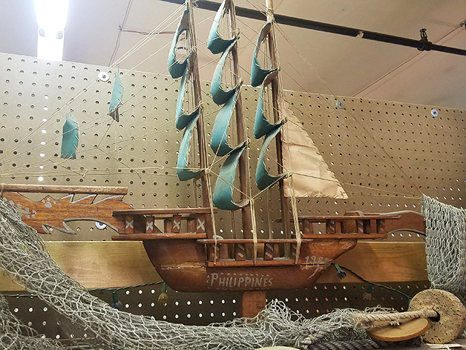 This handcrafted wooden ship from the Philippines sails an ocean of memories, its journey from distant shores continuing in someone's den.