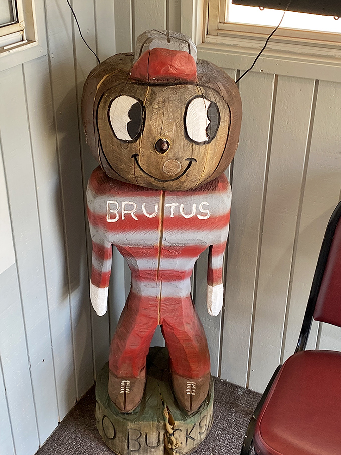 Brutus Buckeye stands guard in wooden form&mdash;a quirky touch of local pride watching over sandwich-seekers with his perpetual smile.