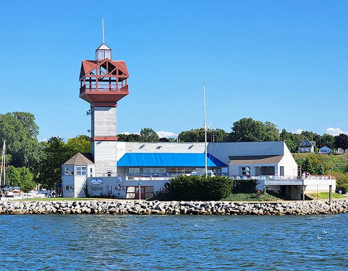 Erie's lighthouse tower reaches skyward like a maritime exclamation point against Lake Erie's endless blue.