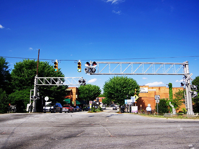 The railroad crossing in Landrum reminds visitors of the town's origins while traffic moves at a pace the trains would recognize. 