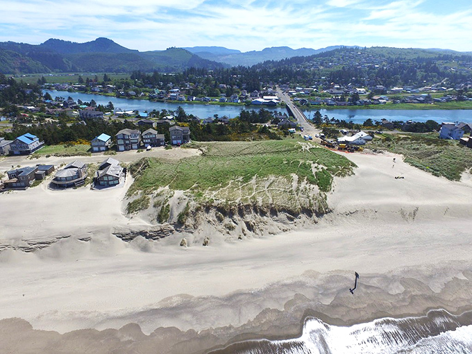 From this aerial view, Pacific City reveals itself as a perfect sandwich of civilization between ocean and forest.
