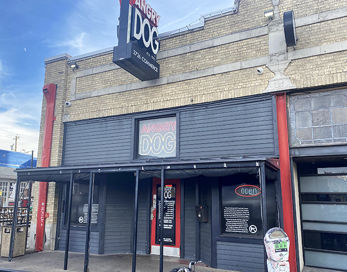 The bold neon sign of Angry Dog beckons hungry visitors to this Dallas hot dog haven where flavor rules supreme.