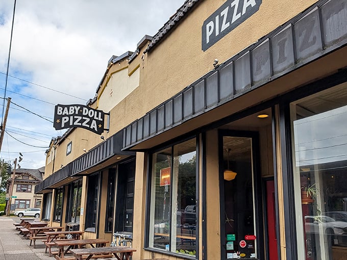Baby Doll Pizza's yellow storefront promises no-nonsense pizza perfection. That classic sign has guided hungry Portlanders to pizza nirvana for years.