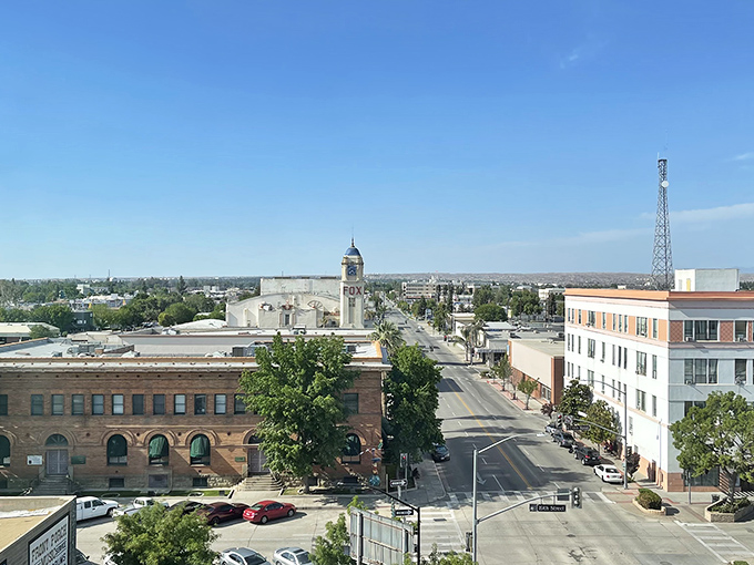 Bakersfield from above &ndash; where the Central Valley stretches like a canvas under that impossibly blue California sky. Downtown's quiet dignity reminds me of those perfect American towns in Spielberg films.