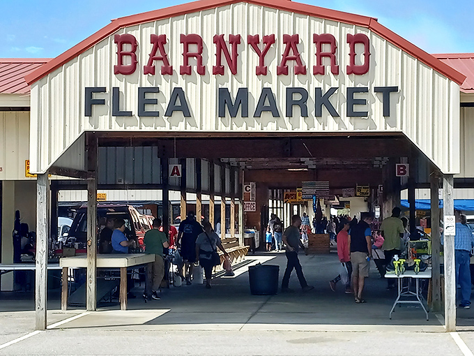The Barnyard Flea Market's entrance beckons like an old friend. Step inside where treasure hunting becomes an Olympic sport!