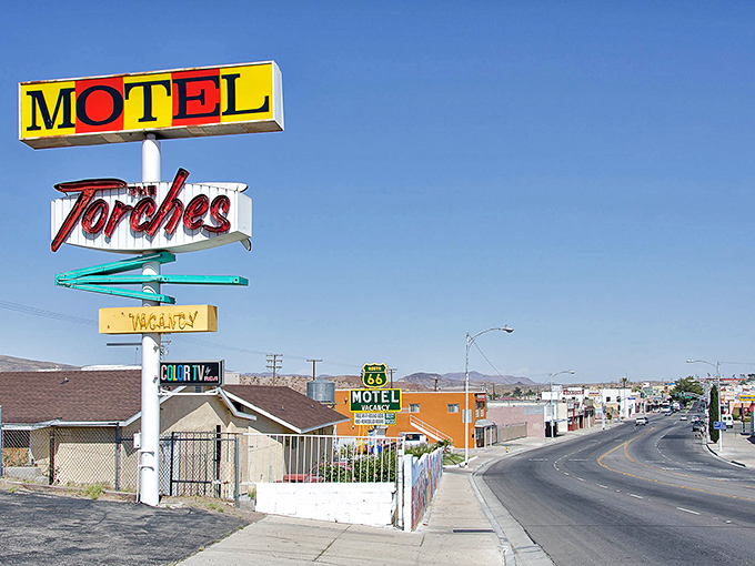 Route 66 nostalgia lives on at The Torches Motel in Barstow, where desert dreams and budget-friendly stays meet under that classic neon glow.