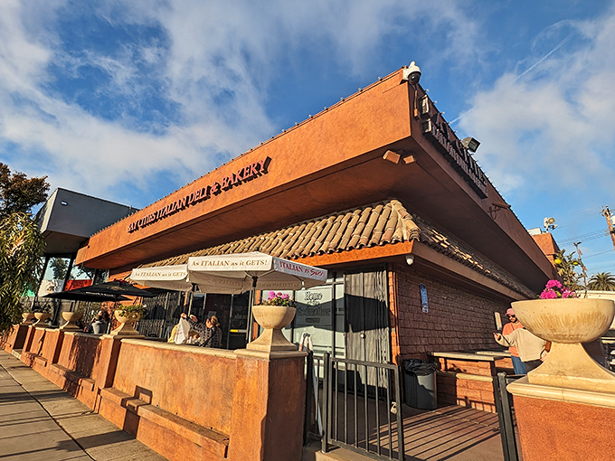 Bay Cities Italian Deli & Bakery: The brick fa&ccedil;ade and patio umbrellas hint at the Italian treasures within. Sandwich paradise awaits!