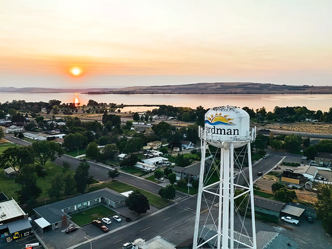 Boardman's water tower stands sentinel as the sun sets over the Columbia River, painting the sky in nature's most spectacular light show.