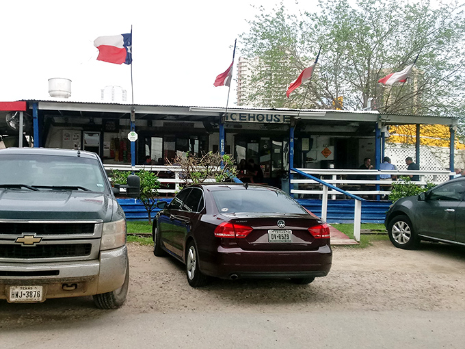 The humble blue shack with Texas flags flying proudly &ndash; where burger magic happens beneath Houston's highways.