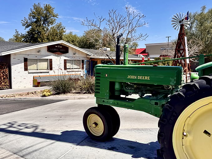 A vintage John Deere tractor welcomes you to Caldwell County BBQ &ndash; where farm equipment and smoky ribs create the perfect Texas-inspired Arizona oasis.