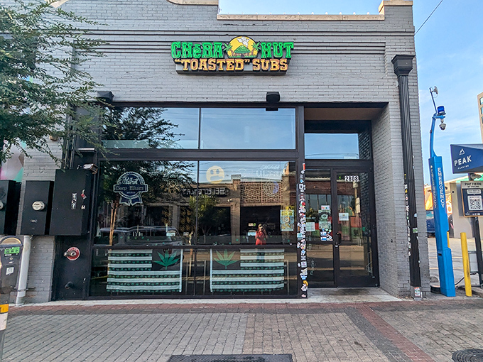 The bright green Cheba Hut sign promises "toasted" subs that'll satisfy your hunger pangs without any illegal substances.