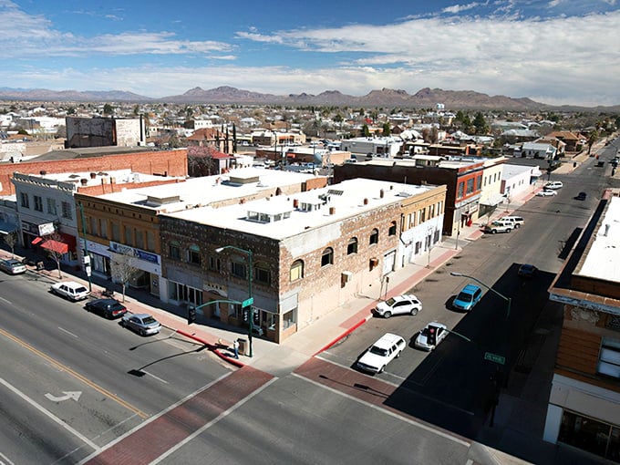Downtown Douglas stretches toward distant mountains, where historic brick buildings tell stories of border town life.