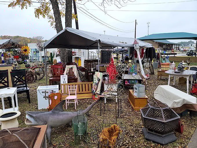 Treasure hunter's paradise! Old chairs, fire pits, and vintage furniture await under autumn trees at Canton's legendary First Monday Trade Days.