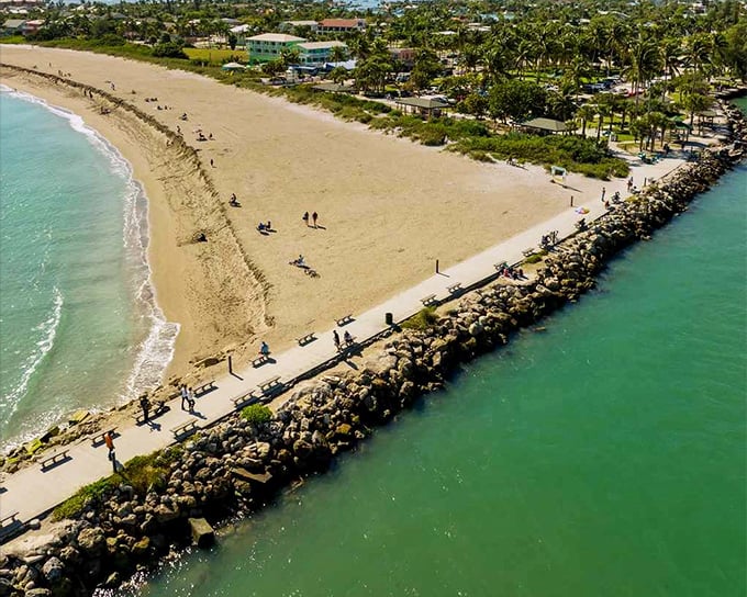 Fort Pierce's jetty stretches into turquoise waters like nature's welcome mat. A perfect spot for sunset strolls without the South Beach crowds.