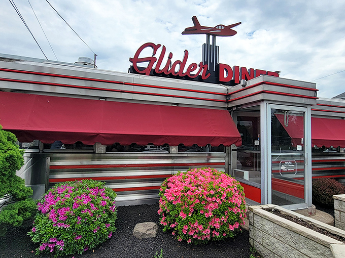 That red and white striped exterior isn't just pretty - it's a beacon calling hungry souls home.