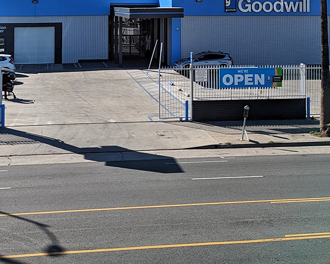 The bright blue Goodwill on Sunset Boulevard stands like a beacon of bargain possibilities. Open doors, open wallets!
