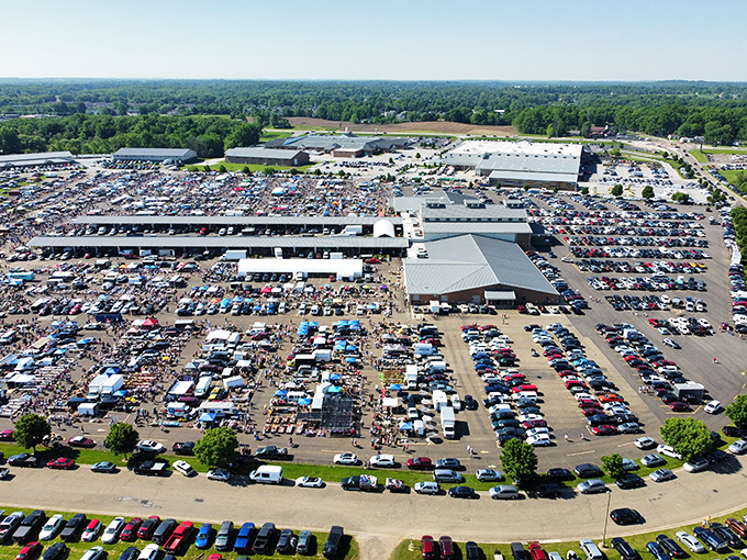Aerial view of bargain hunter heaven! Hartville Marketplace sprawls like a small city, with cars filling every inch of the massive parking lot.