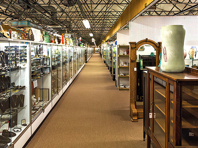 Endless aisles of glass display cases at Heart of Ohio Antique Center. Like a museum where everything's for sale!
