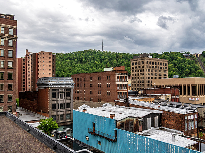 Downtown Johnstown showcases its industrial heritage with brick buildings nestled against lush green hills. History and nature in perfect harmony!