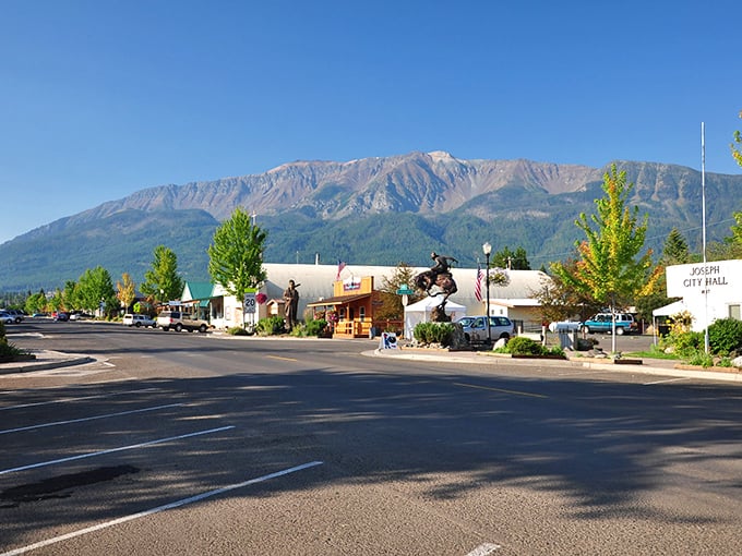 Joseph's main street sits beneath the watchful gaze of the Wallowa Mountains, like nature's own movie backdrop.