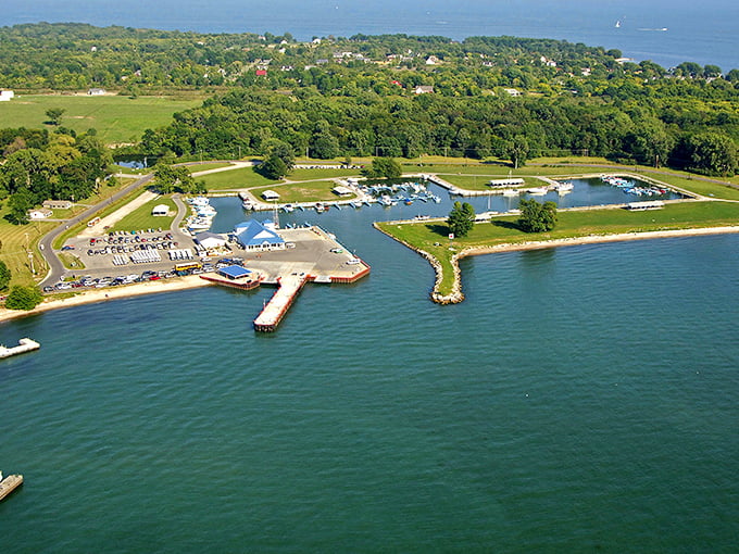 Aerial view of Kelleys Island marina, where boats nestle like colorful fish in a perfect blue aquarium. Lake Erie's playground awaits!