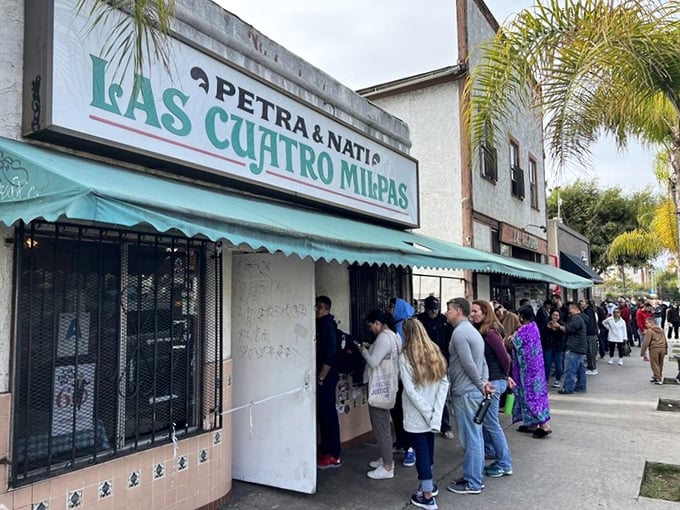 The line at Las Cuatro Milpas stretches down the block &ndash; a sure sign that food paradise awaits inside.