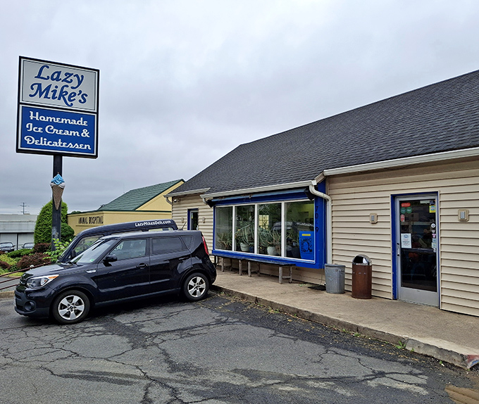 Lazy Mike's exterior says "no rush" with its blue-trimmed charm. The kind of place where sandwich dreams and ice cream fantasies peacefully coexist.