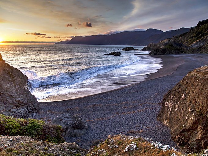 Sunset paints Little Black Sands Beach in gold, turning this hidden cove into nature's own masterpiece.