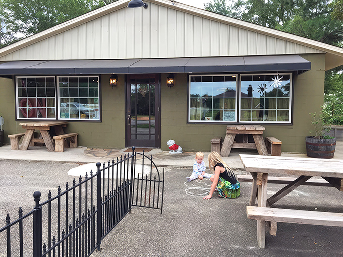 The cozy exterior of Little City Diner beckons like a friend's kitchen, complete with picnic tables for sunny morning chats.