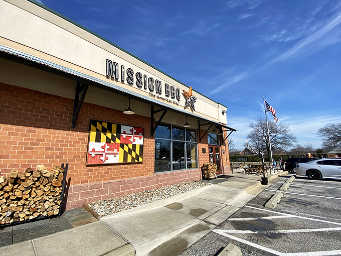 Mission BBQ's patriotic storefront promises a taste of America with every bite. That stack of firewood isn't just for show!