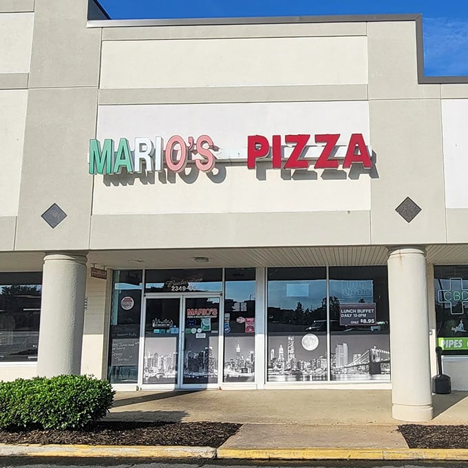 Mario's Pizza sign glows with promise &ndash; the kind of place where the aroma of melting cheese hits you before the door even opens.