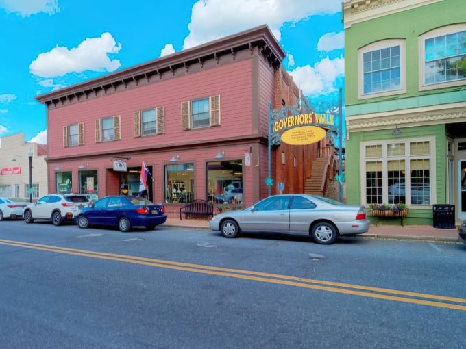 Governor's Walk in Milton invites you with its cheerful yellow sign and historic brick buildings &ndash; small-town charm at its finest!