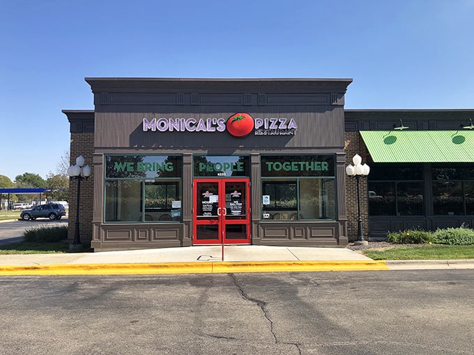 The bright red doors of Monical's practically scream "Come in, we've got pizza that'll make your day!"